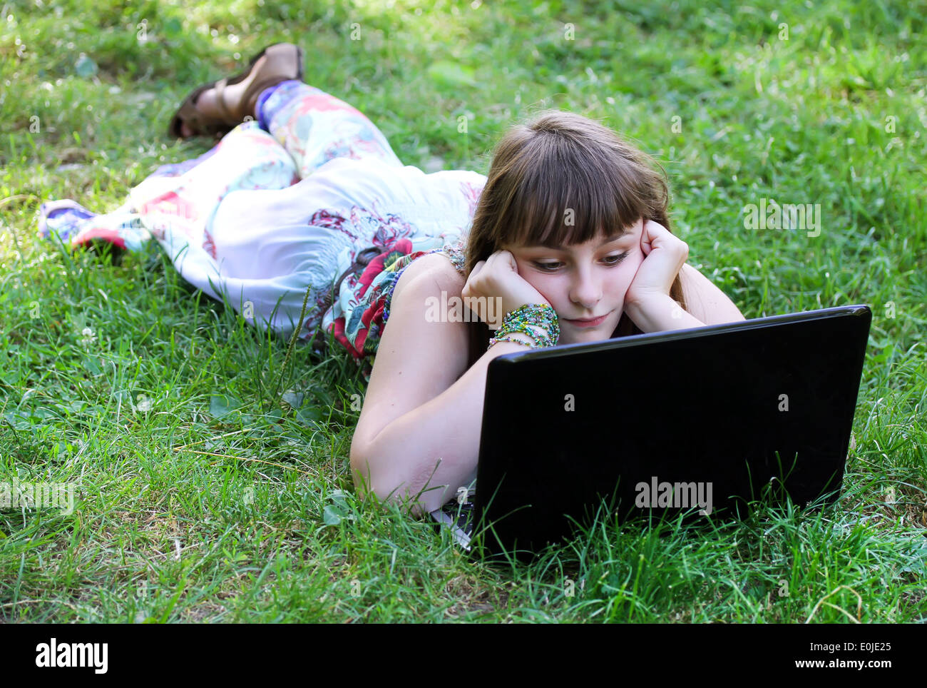 Beauty girl with laptop outdoors Stock Photo - Alamy
