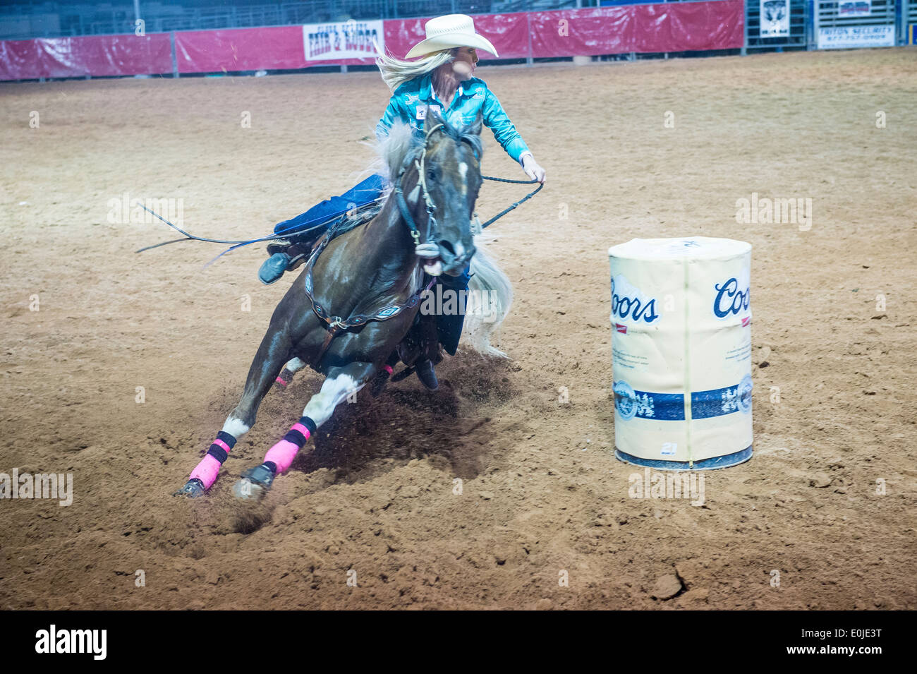 Cowgirl Participating in a Barrel racing competition in the Clark ...