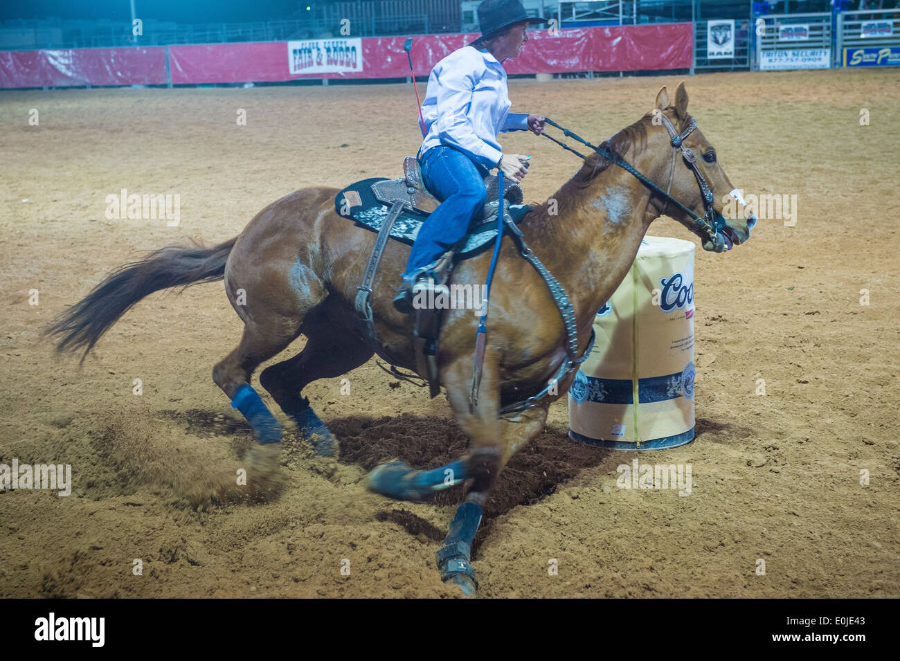 Cowgirl Participating in a Barrel racing competition in the Clark ...