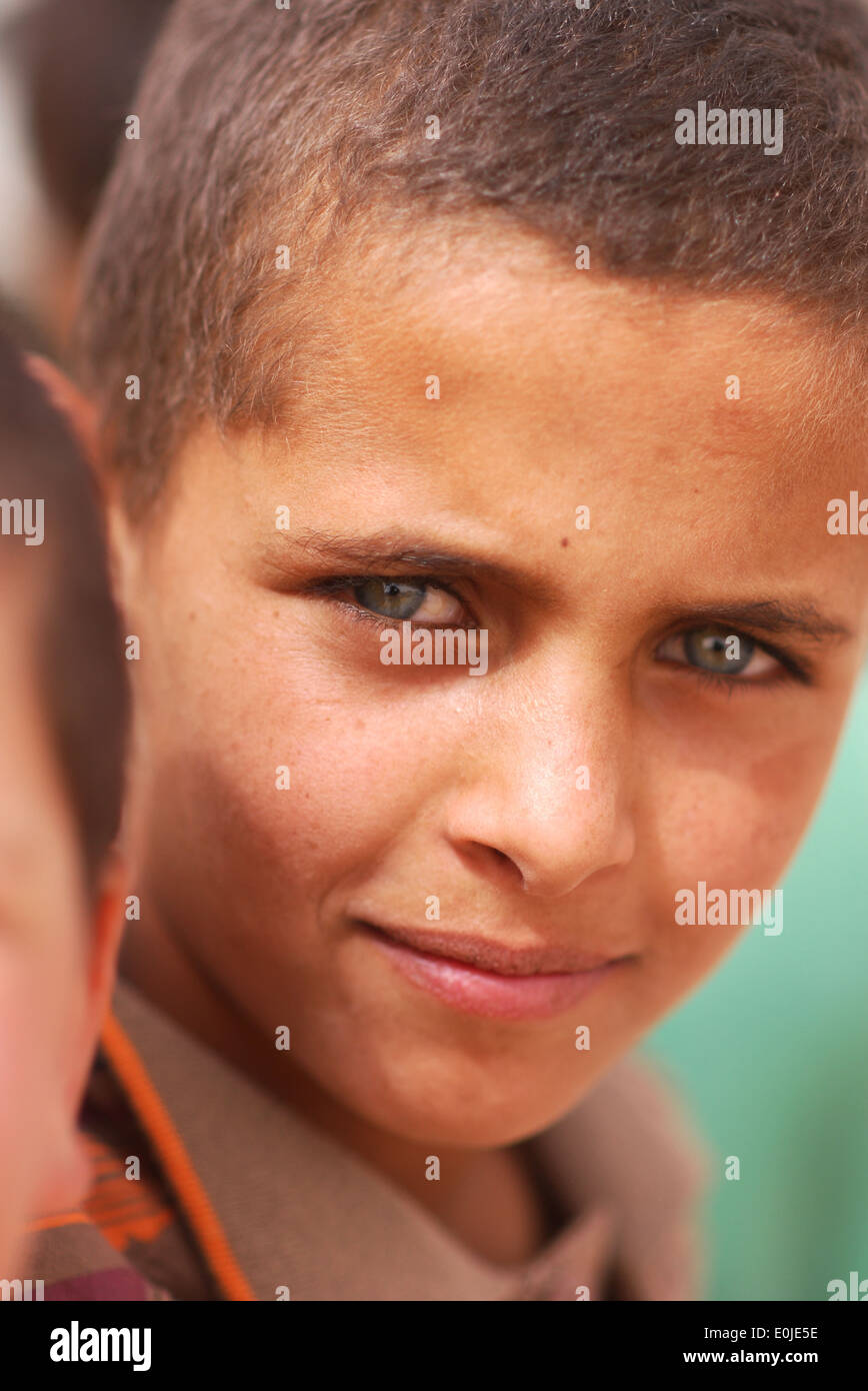 An Iraqi boy waits outside the Al Aswar Iraqi police station to greet U ...