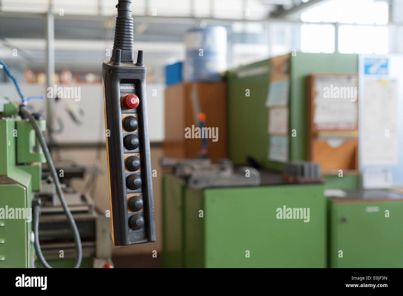 Emergency Stop button on an industrial machine at a repair shop Stock ...
