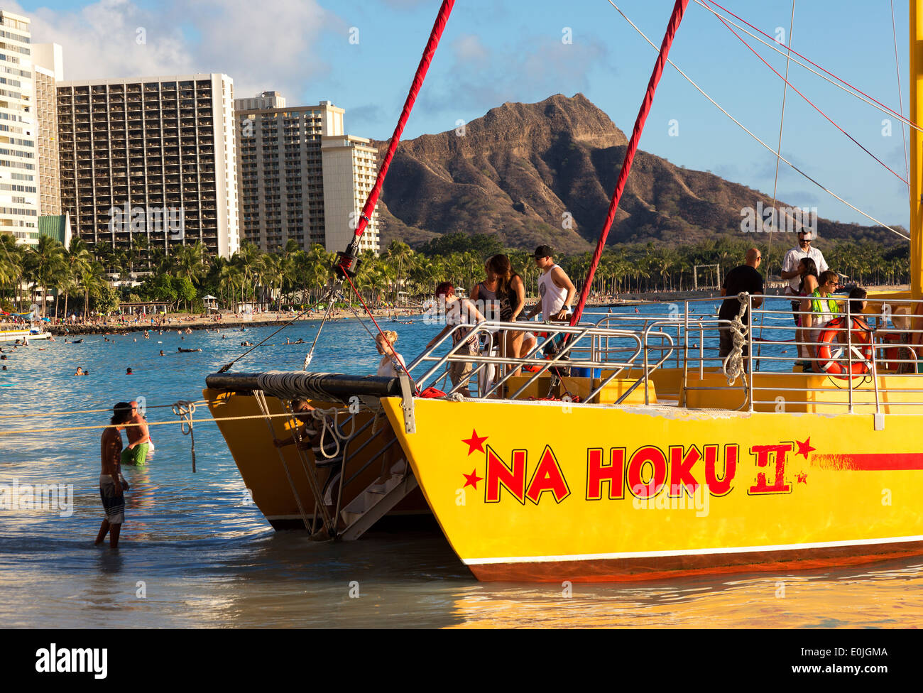 Catamaran unloading tourist on Waikiki Beach, Honolulu, Oahu, Hawaii ...