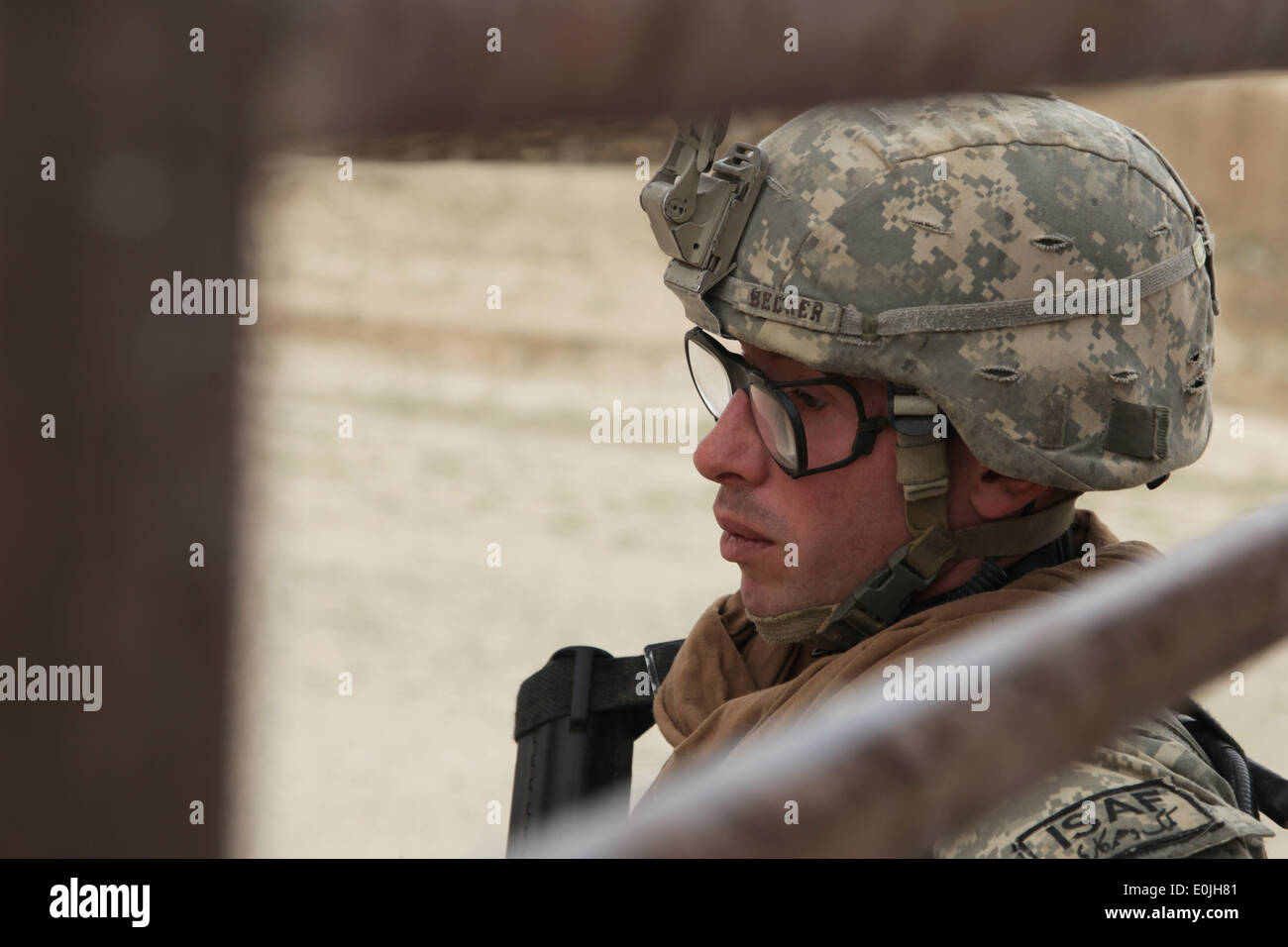 A U.S. Army Soldier listens to orders from his platoon leader during a ...