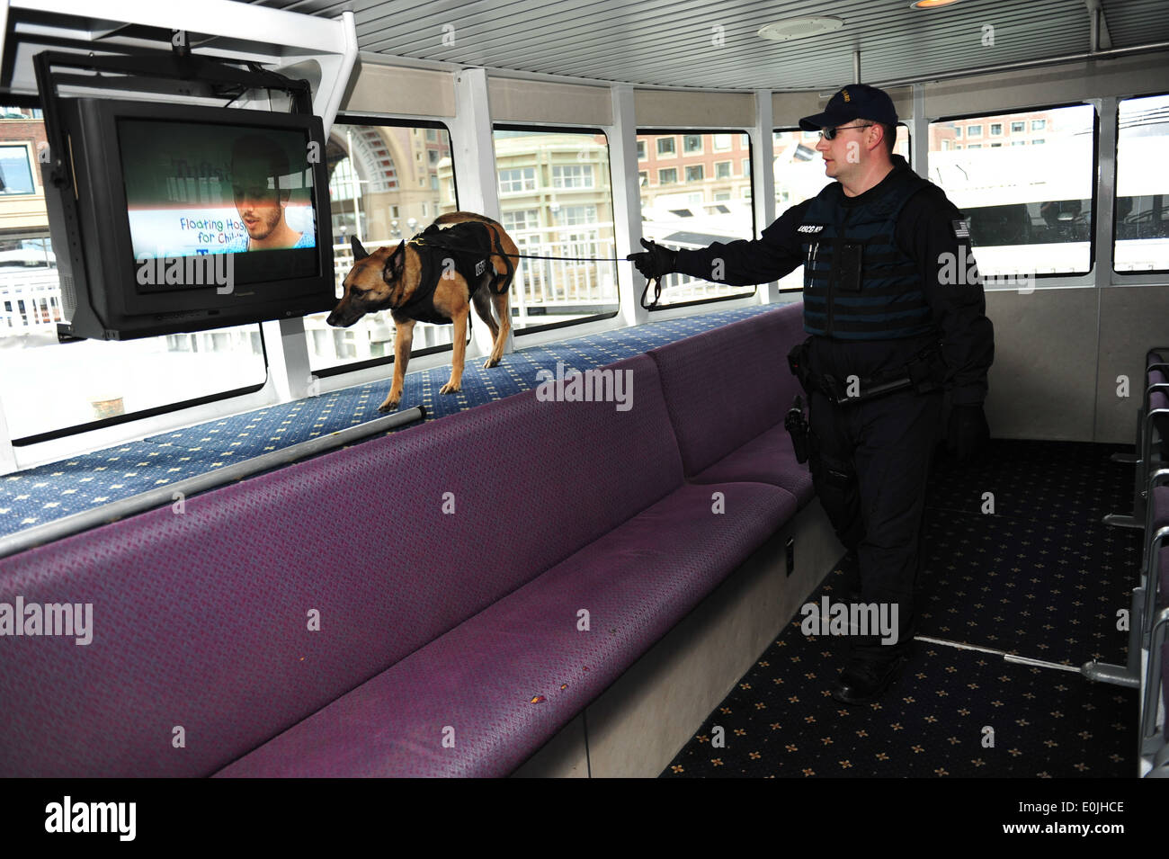 Petty Officer 2nd Class Nicholas Heinen, a canine handler from Maritime ...