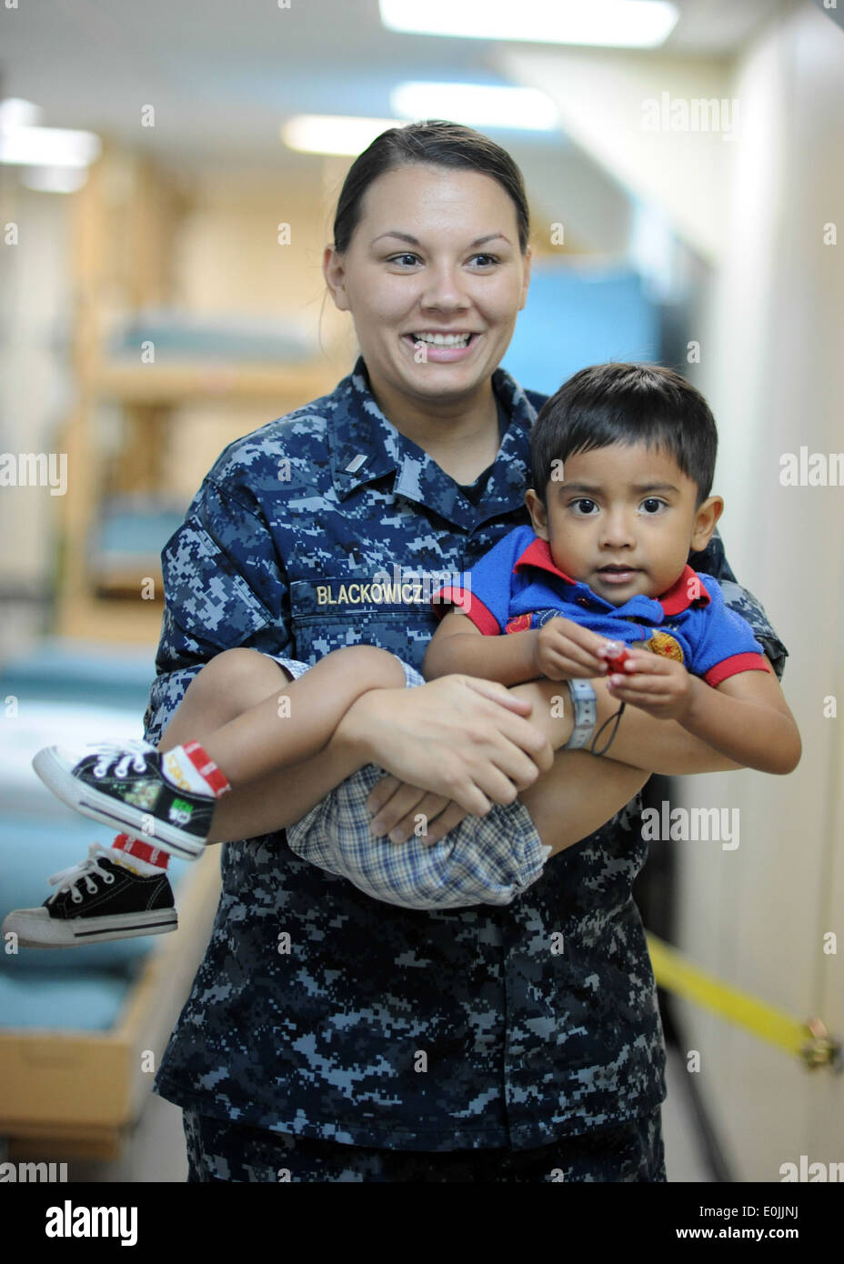 A young patient relaxes in the post-surgery ward with Lt. j.g. Sarah ...