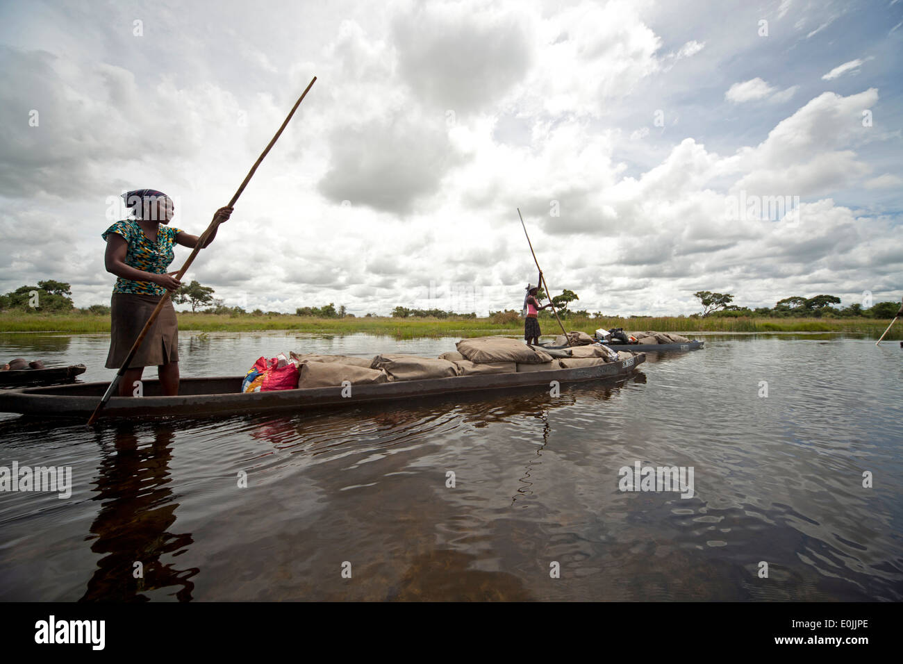 Female poler on her traditional boat in the okavango delta hi-res stock ...
