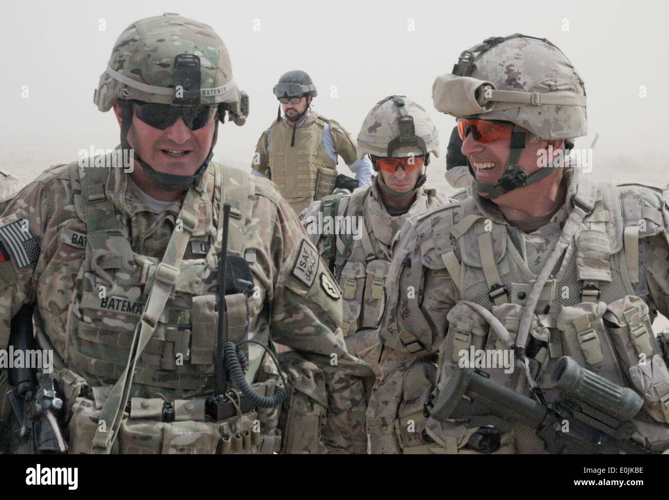 U.S. Army Lt. Col. Sean Bateman (left) of Task Force Automatic links up ...
