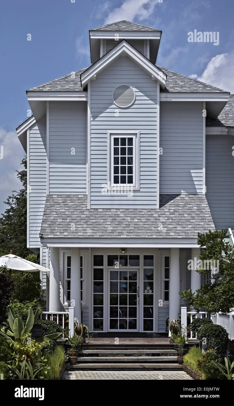 Large dormer window and shingled roof construction with wood clad ...