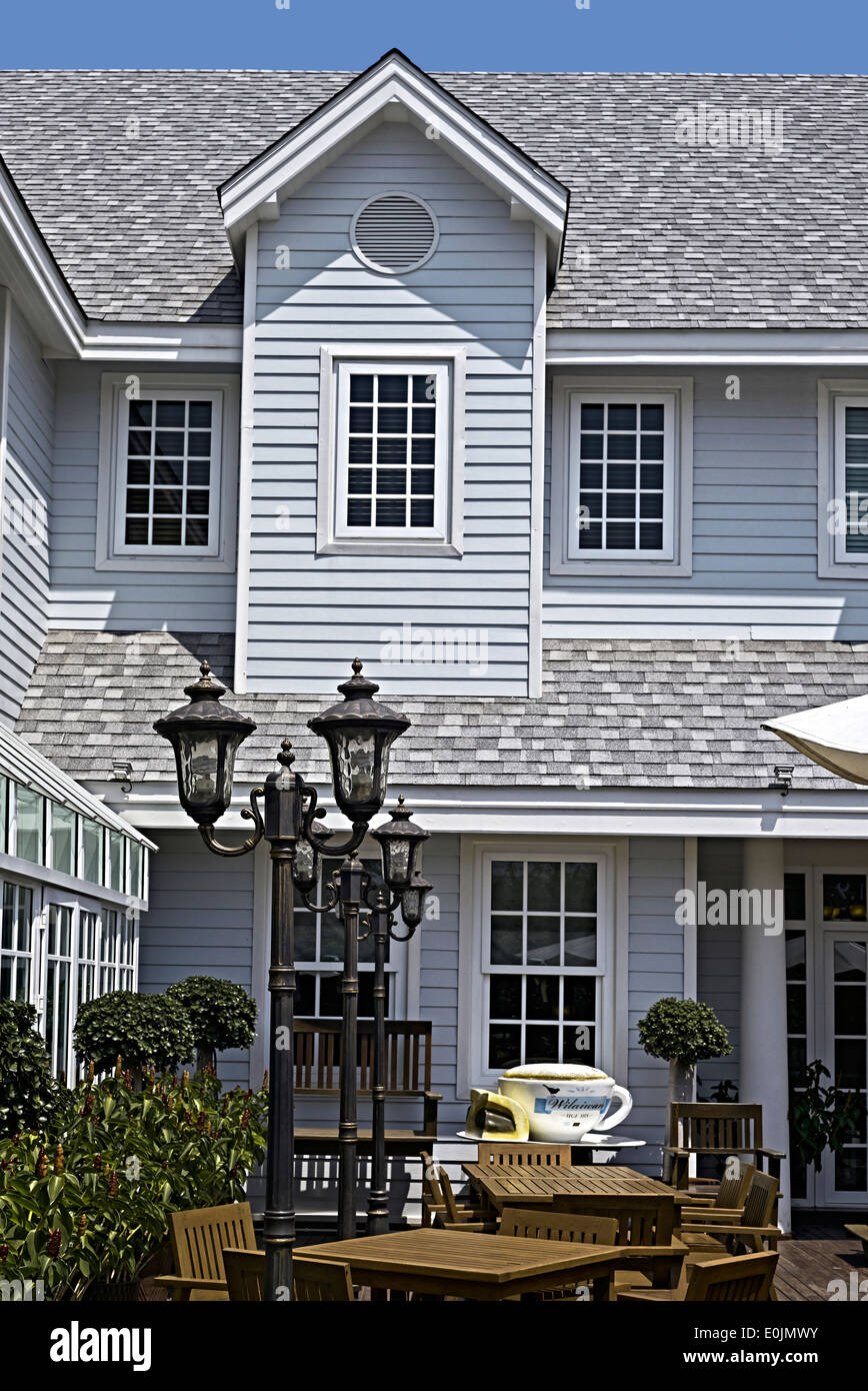 Dormer window and shingled roof construction with wood clad facade ...