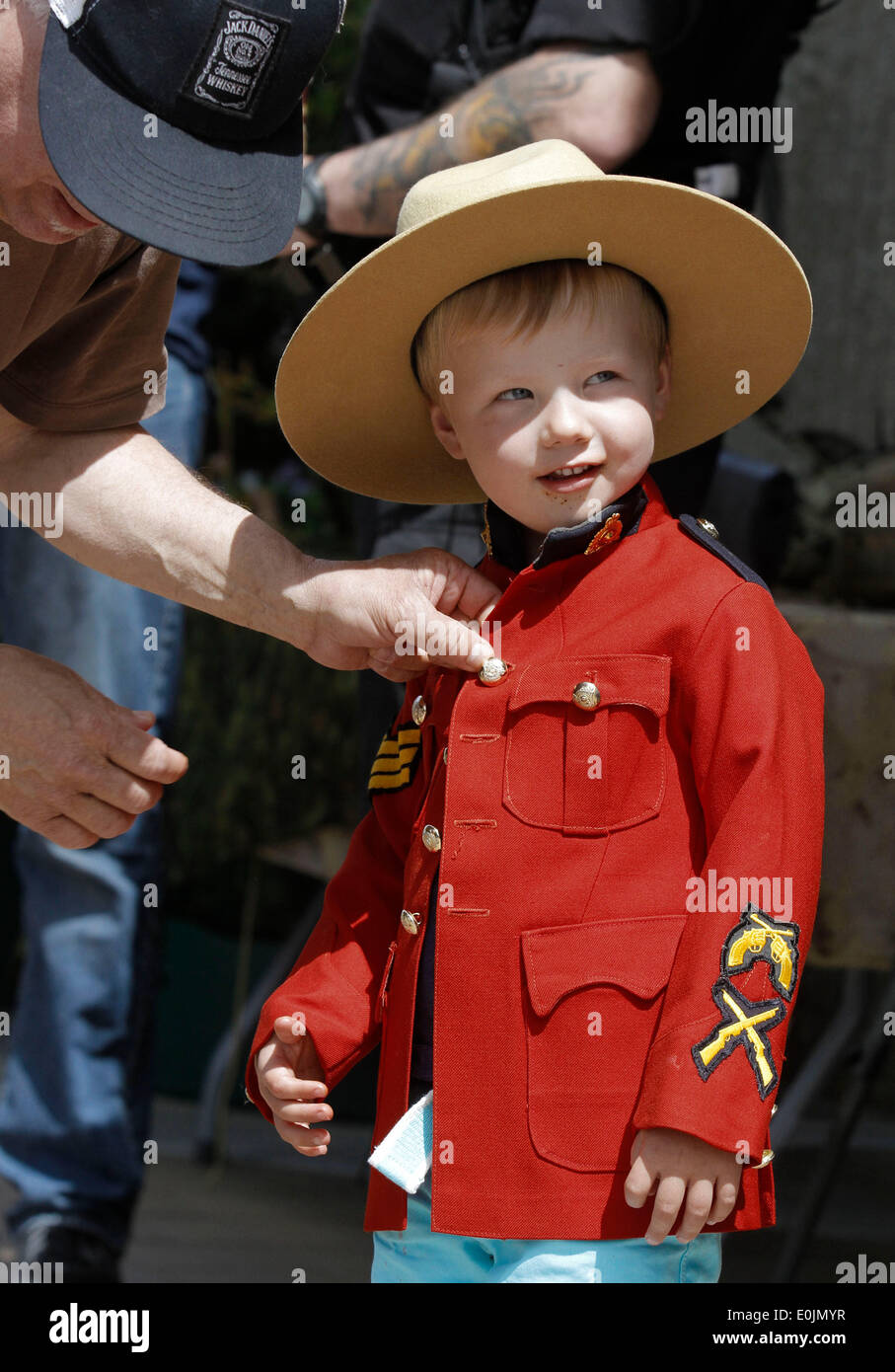 Vancouver, Canada. 14th May, 2014. A child puts on mounted police ...