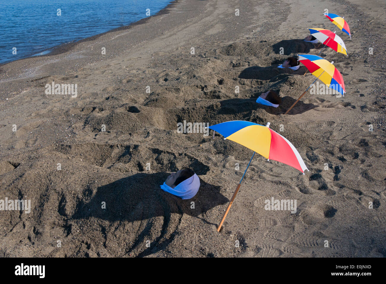 Tourists receiving steam sand bath, Ibusuki, Kagoshima Prefecture ...