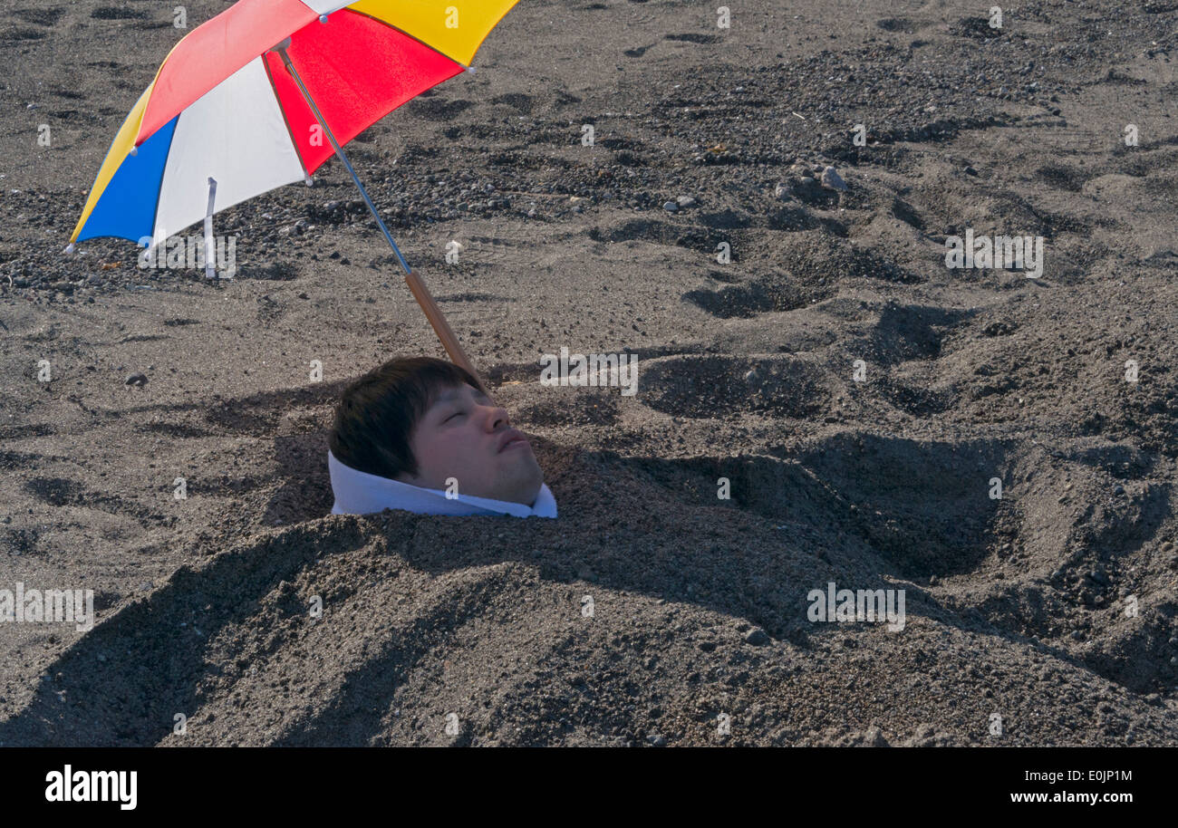 Tourists receiving steam sand bath, Ibusuki, Kagoshima Prefecture ...