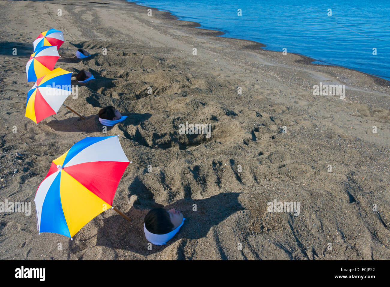 Tourists receiving steam sand bath, Ibusuki, Kagoshima Prefecture ...