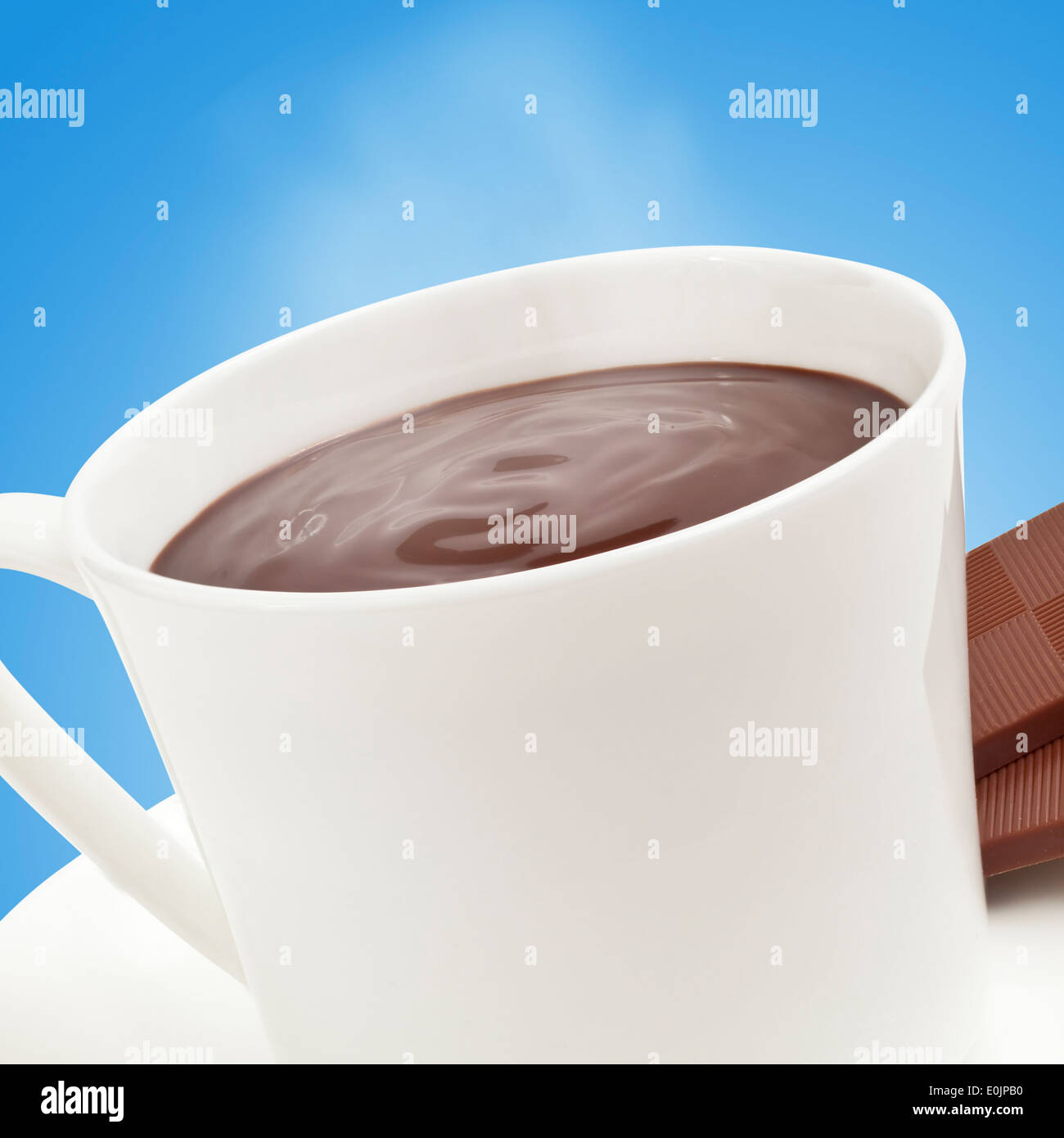 Hot cocoa in a white cup with steam rising from the surface Stock Photo ...