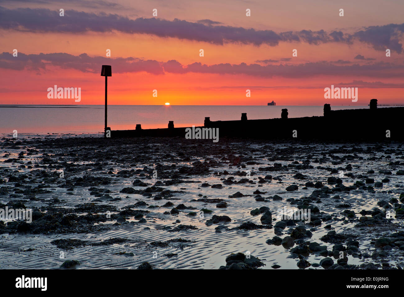 Swalecliffe, near Whitstable, Kent UK 15th May 2014: The sun rises over ...