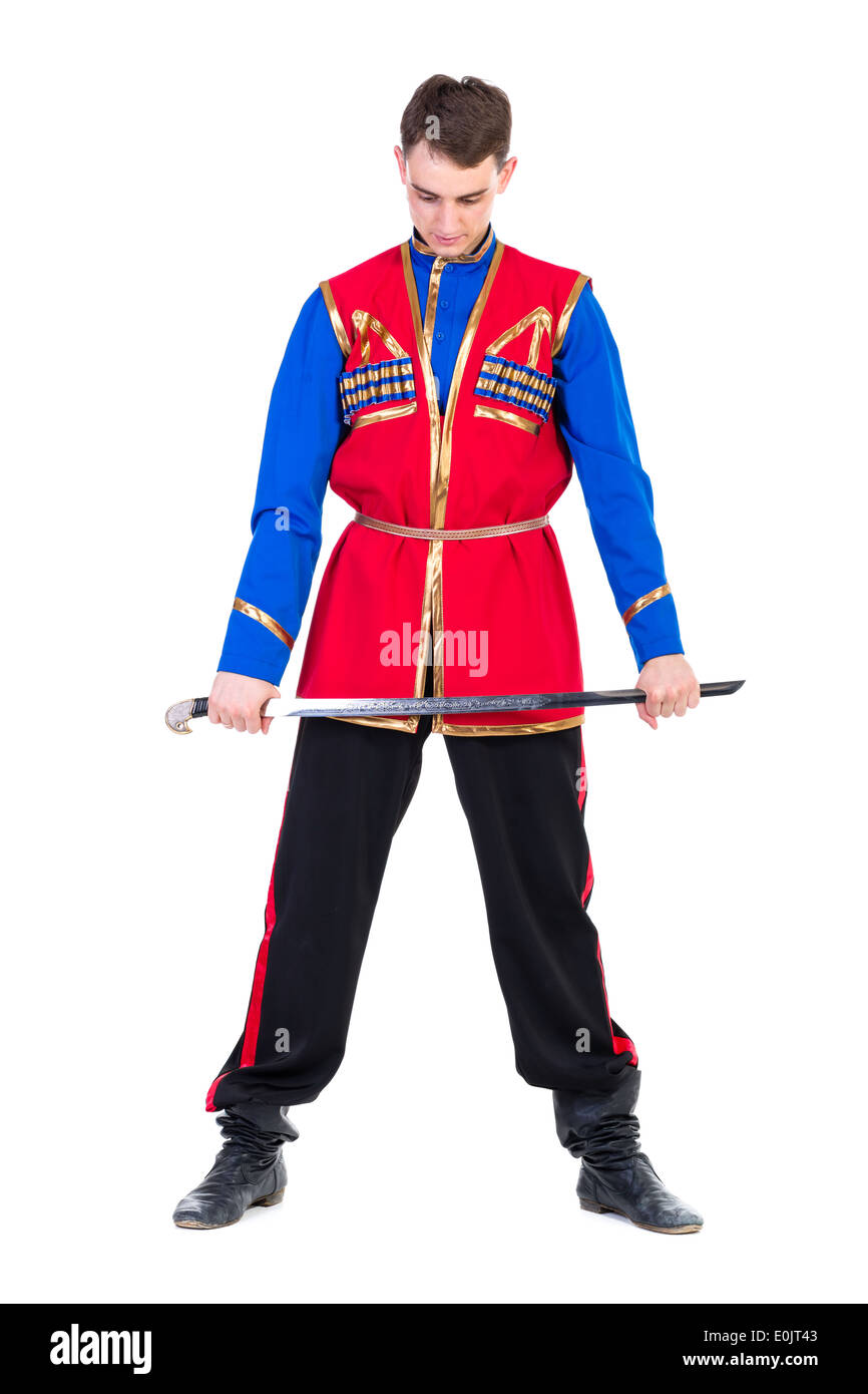 Russian cossack dance. Young dancer posing with sword Stock Photo - Alamy