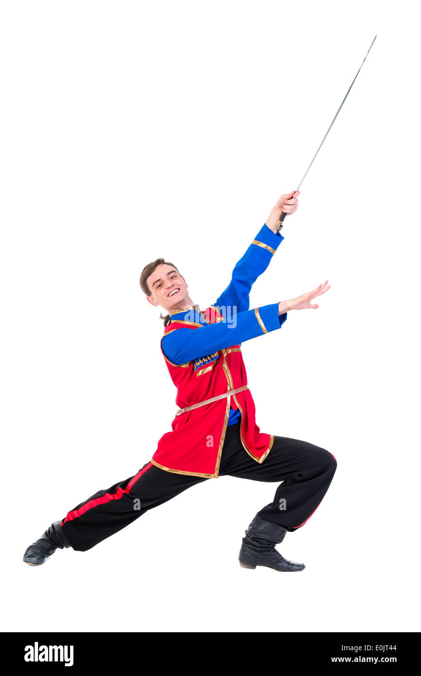 Russian cossack dance. Young dancer posing with sword Stock Photo - Alamy