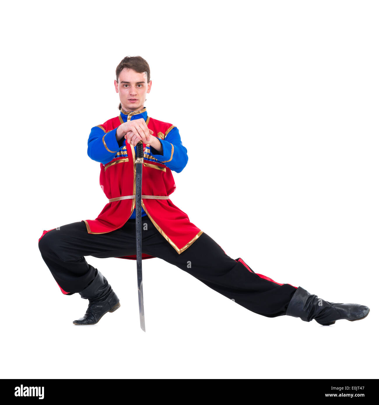 Russian cossack dance. Young dancer posing with sword Stock Photo - Alamy