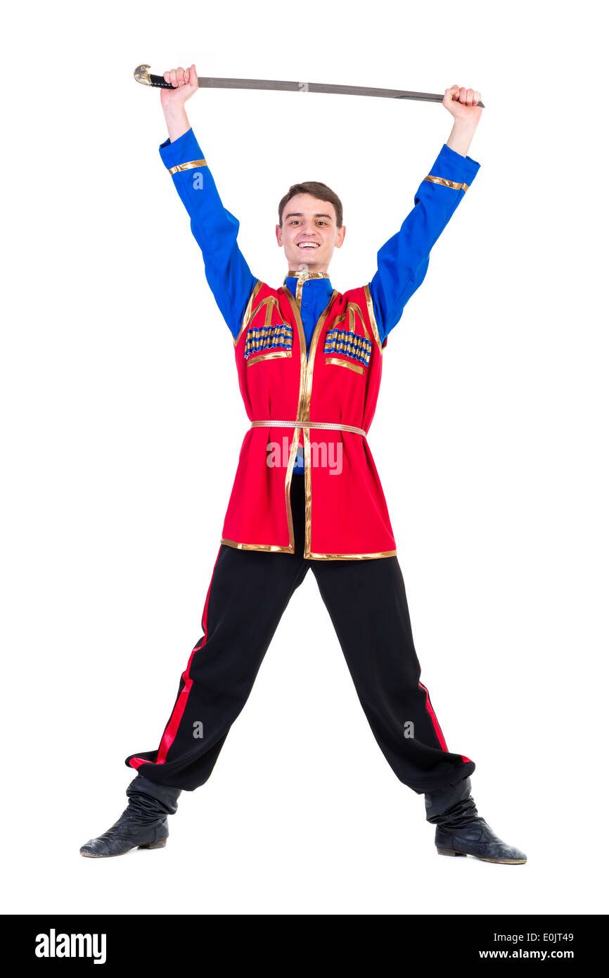 Russian cossack dance. Young dancer posing with sword Stock Photo - Alamy