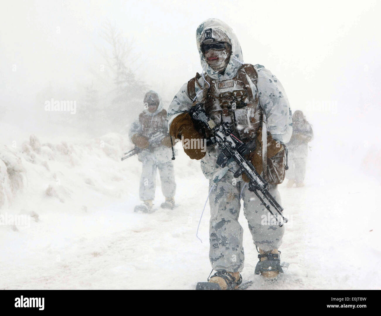 Marines patrol through strong winds and heavy snow March 2 during a ...
