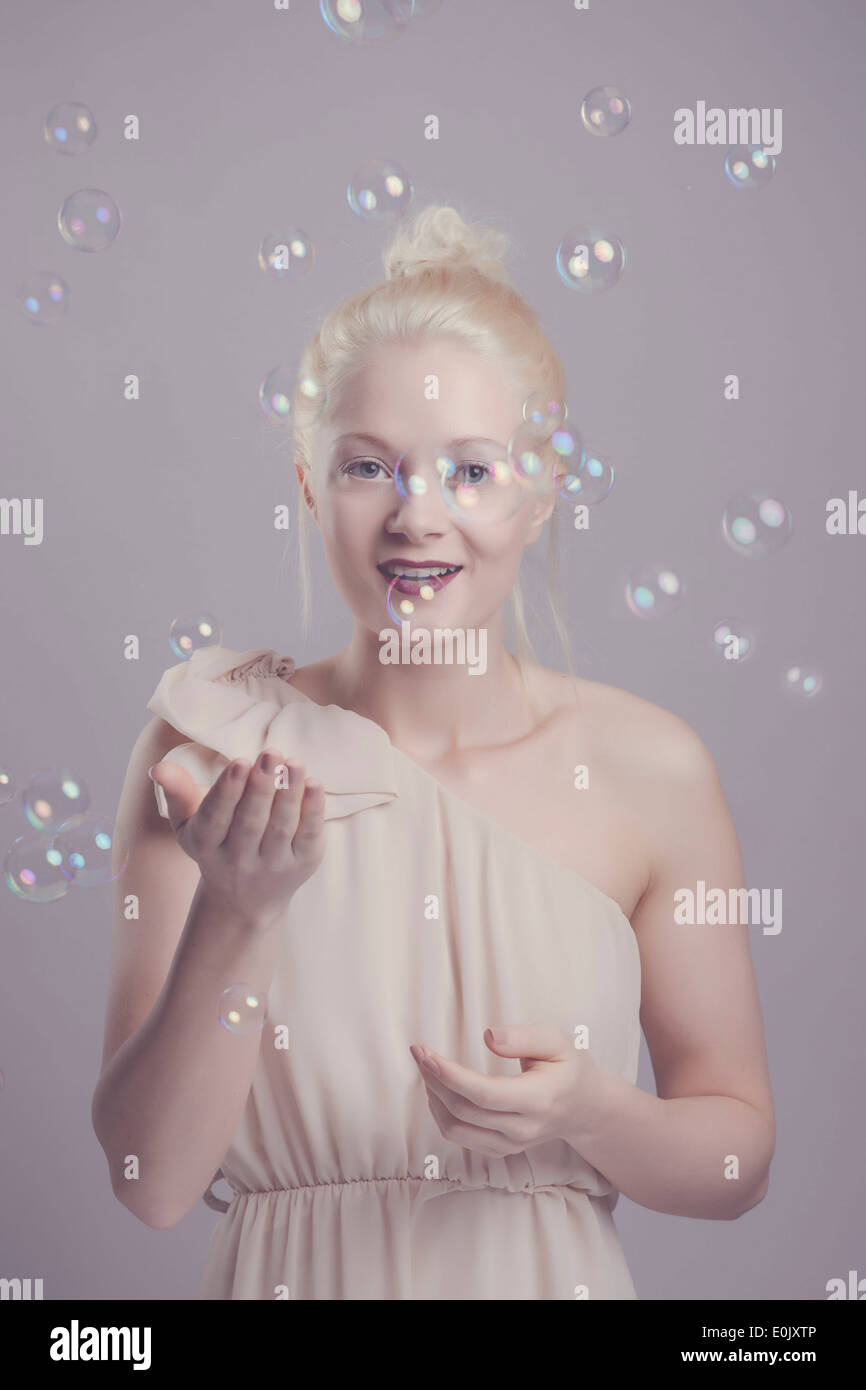 young, blond woman with soap bubbles, (Model release Stock Photo - Alamy