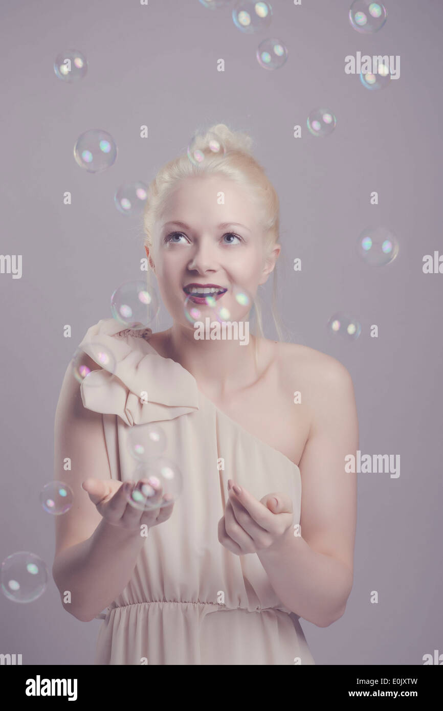 young, blond woman with soap bubbles, (Model release Stock Photo - Alamy