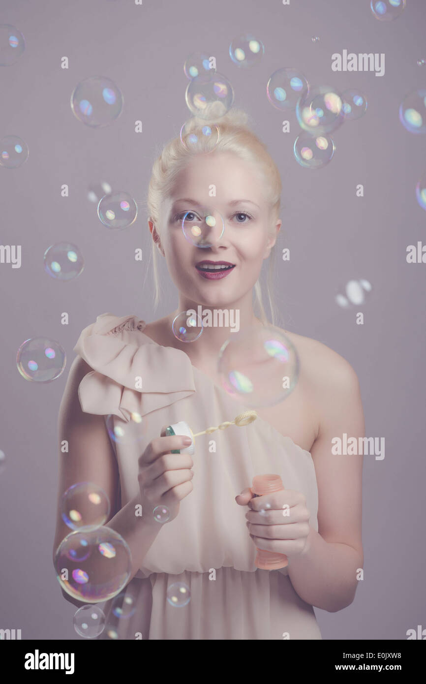 young, blond woman with soap bubbles, (Model release Stock Photo - Alamy