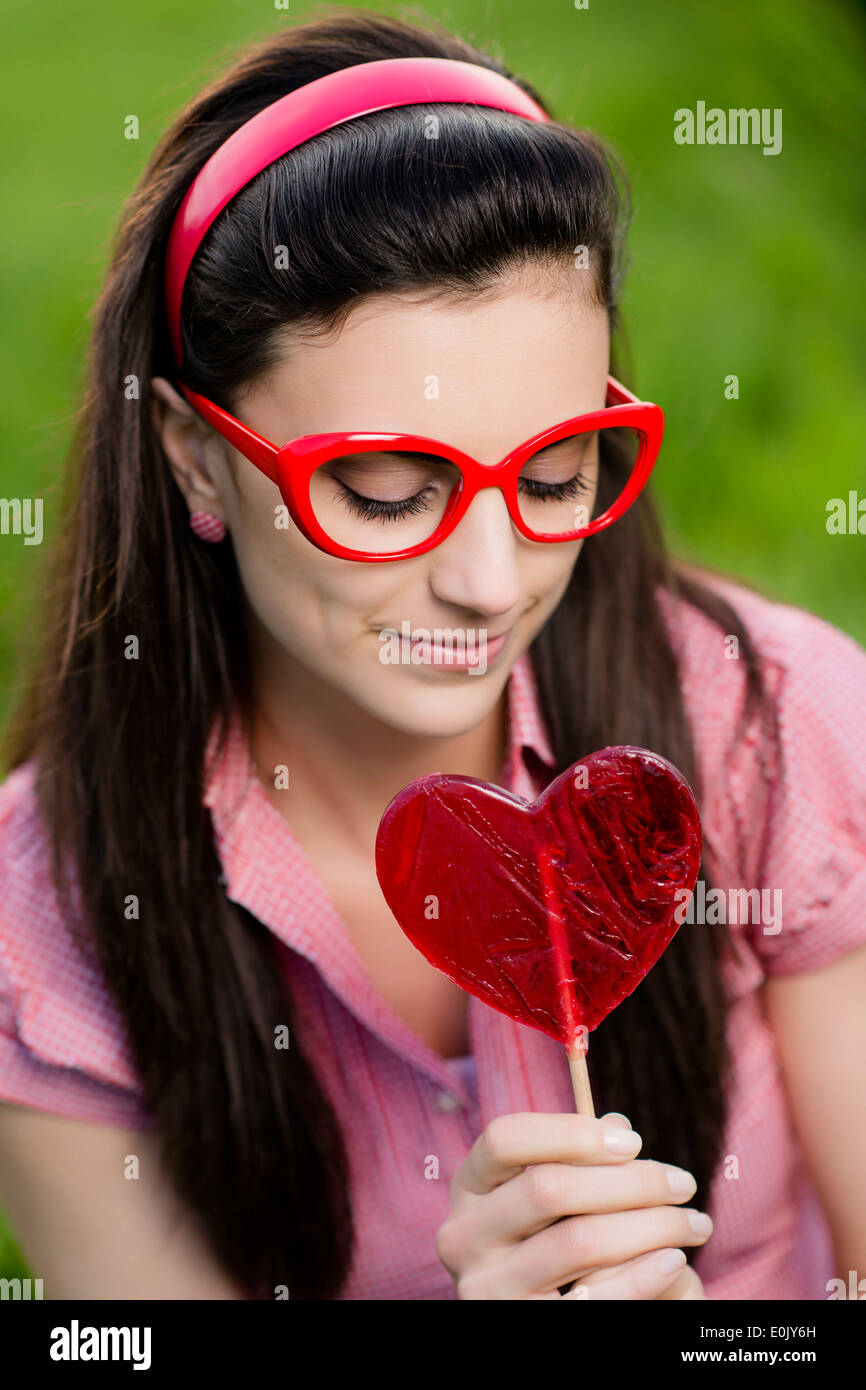 woman with heart lolly, (Model release Stock Photo - Alamy