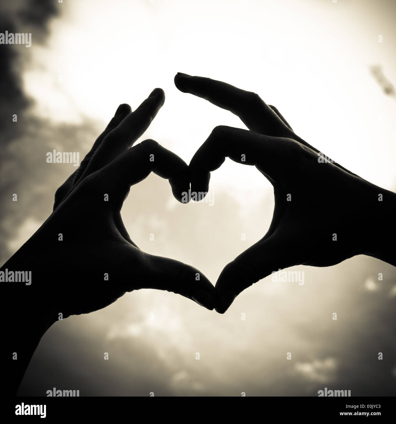 love shape hand silhouette in sky Stock Photo - Alamy
