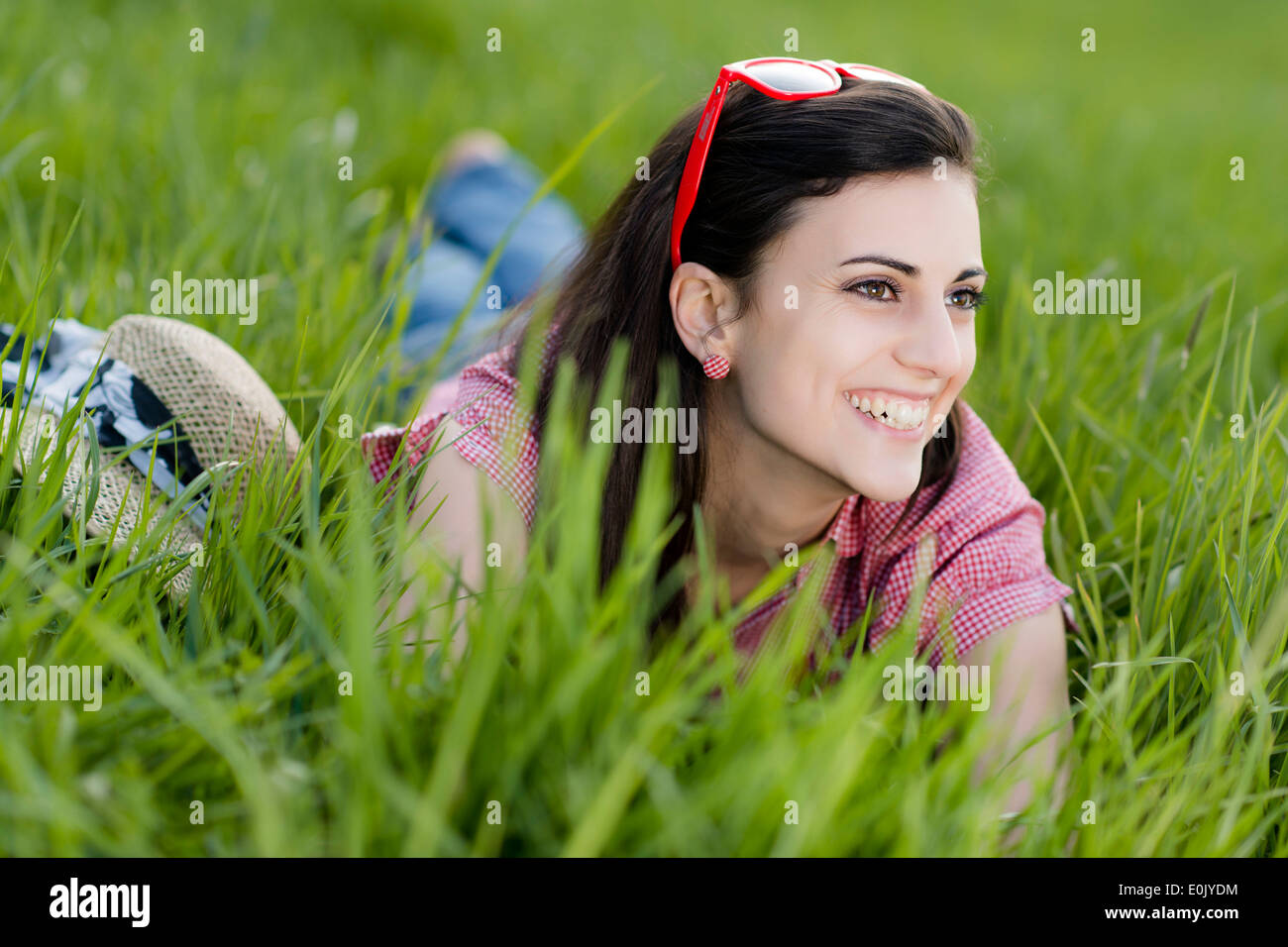 Young woman relaxing on the spring meadow, (Model release Stock Photo ...