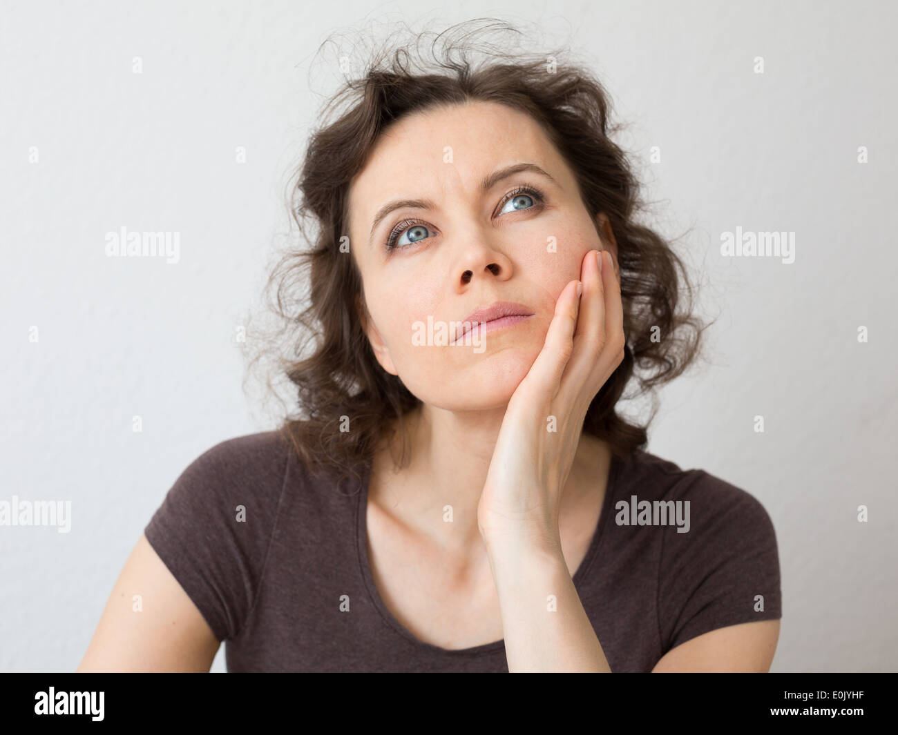 Woman thinking about seriously Stock Photo - Alamy