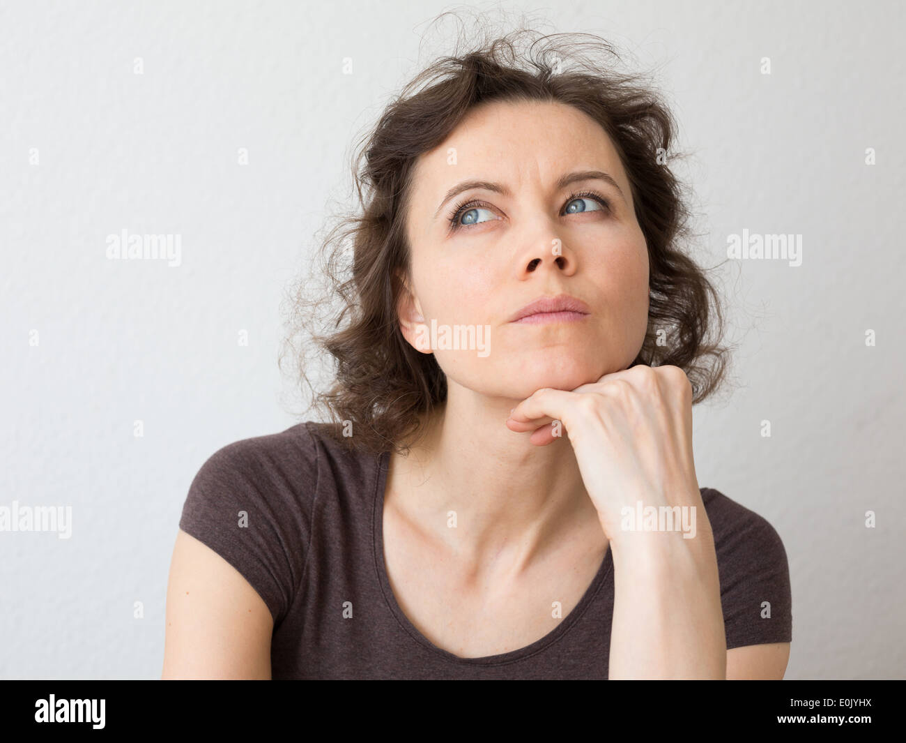 Woman thinking about seriously Stock Photo - Alamy