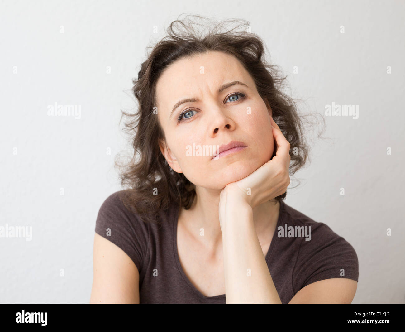 Woman thinking about seriously Stock Photo - Alamy