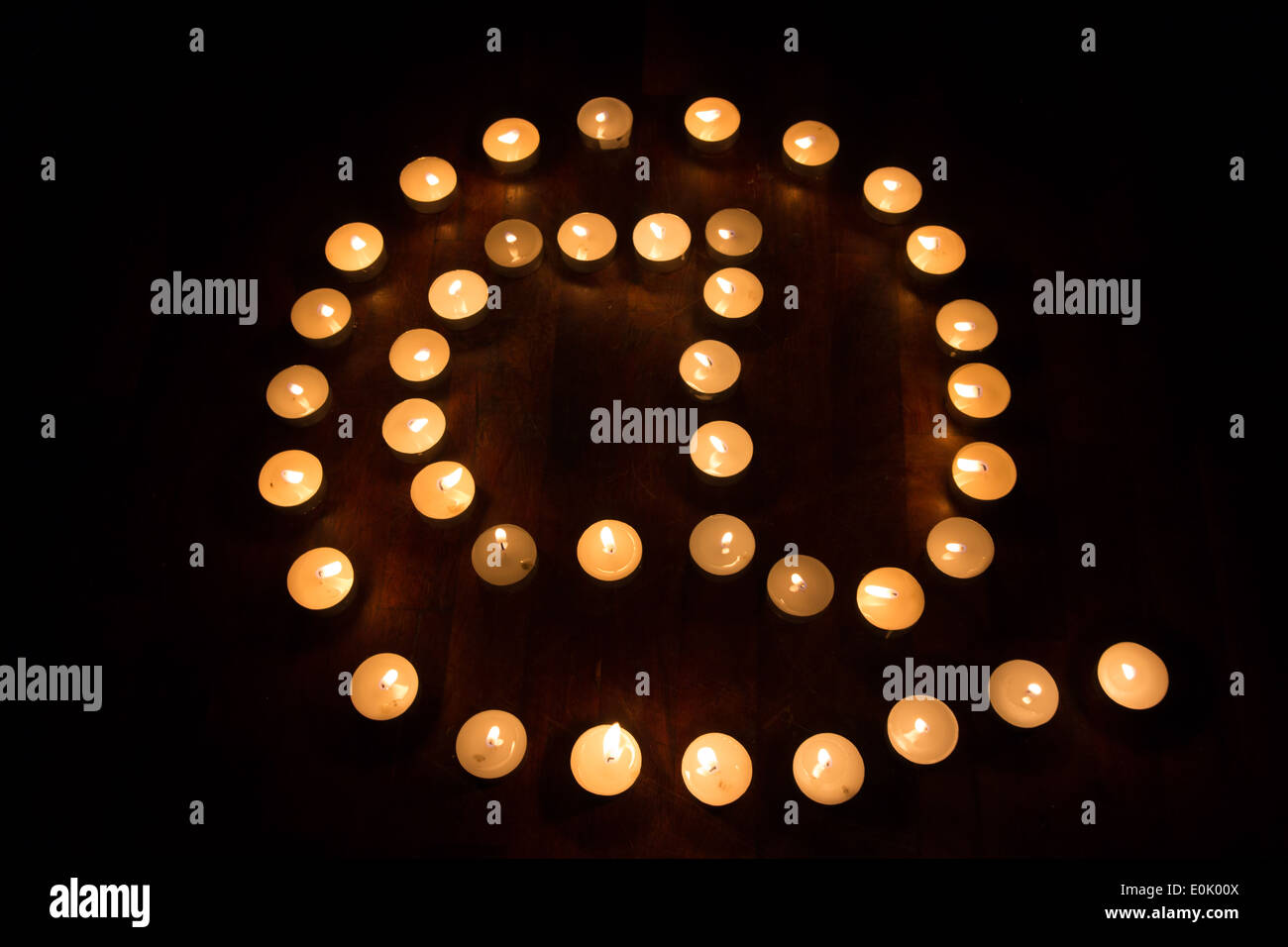 candle forming @ symbol Stock Photo - Alamy