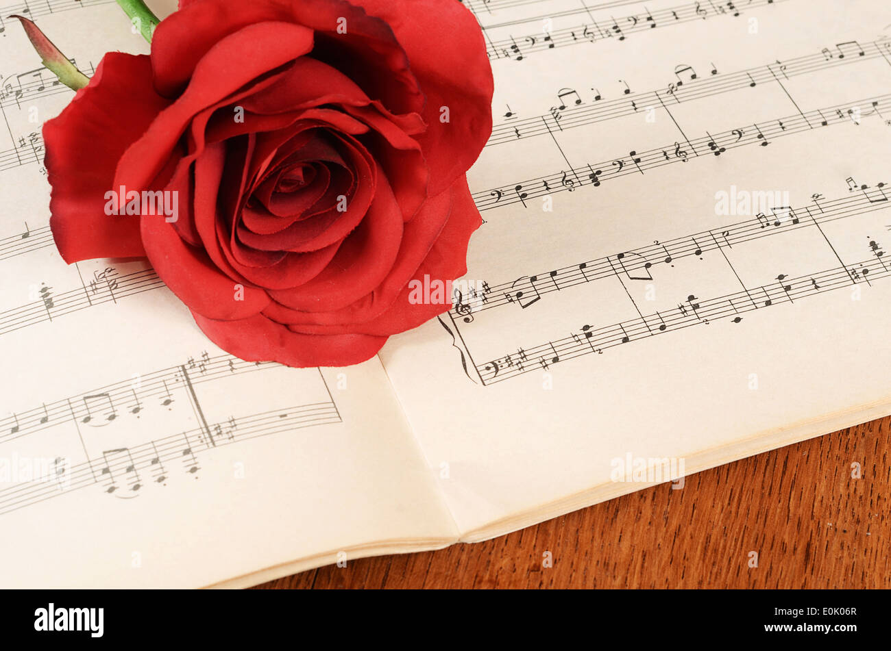 The rose on notebooks with musical notes Stock Photo - Alamy