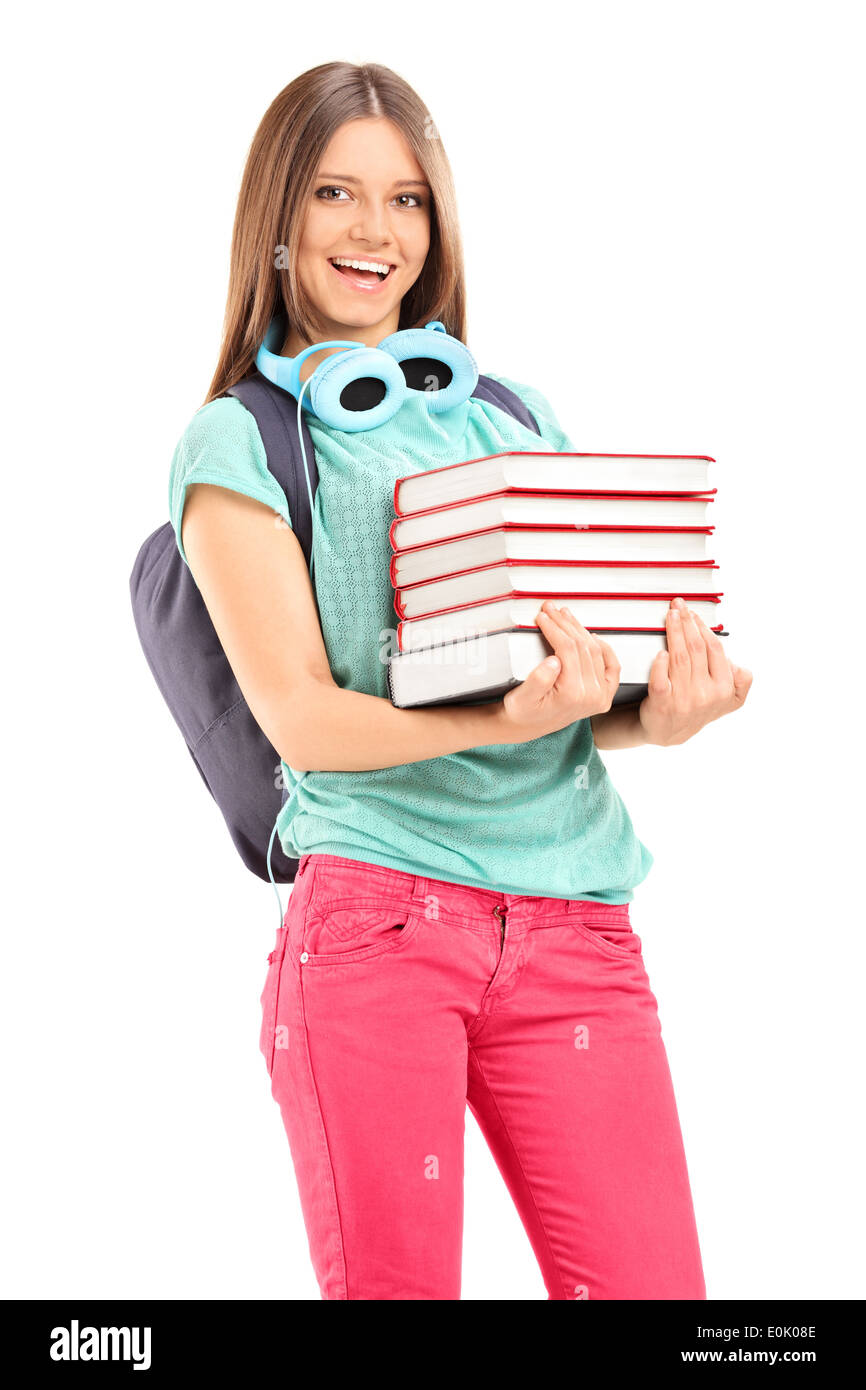 Female student carrying a pile of books Stock Photo - Alamy
