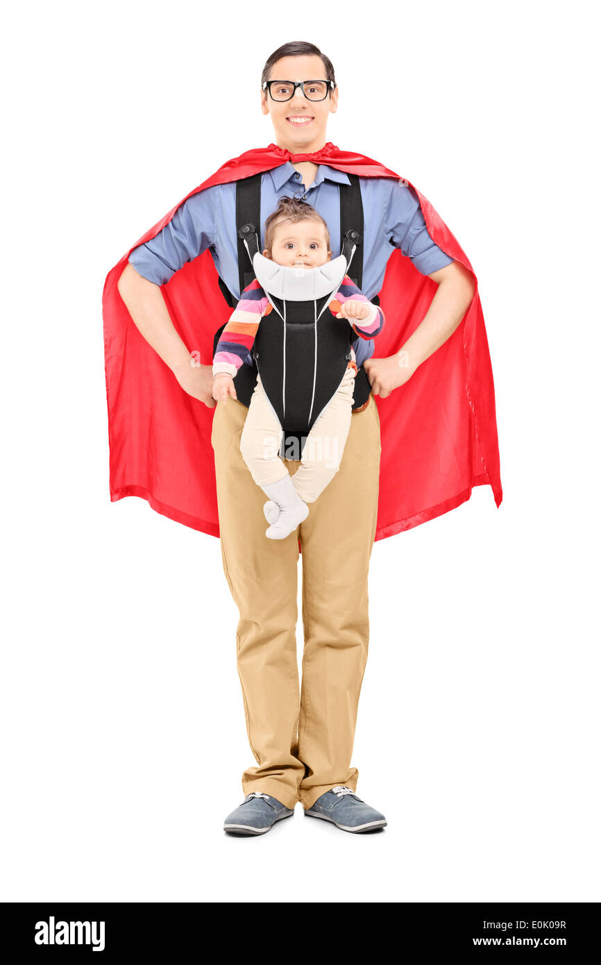 Full length portrait of a male superhero carrying his baby daughter ...