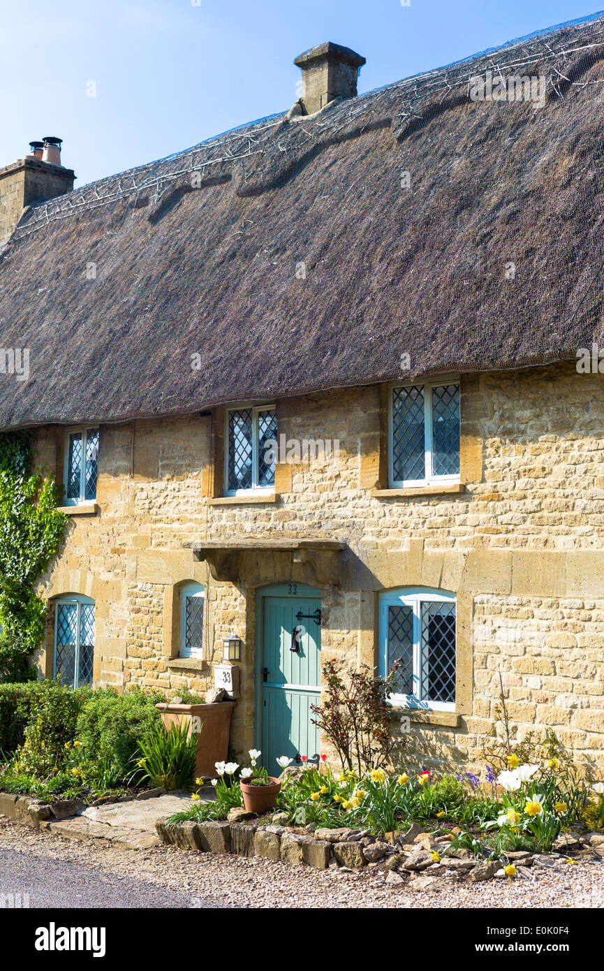 Quaint thatched cottage with traditional thatching and leaded light ...