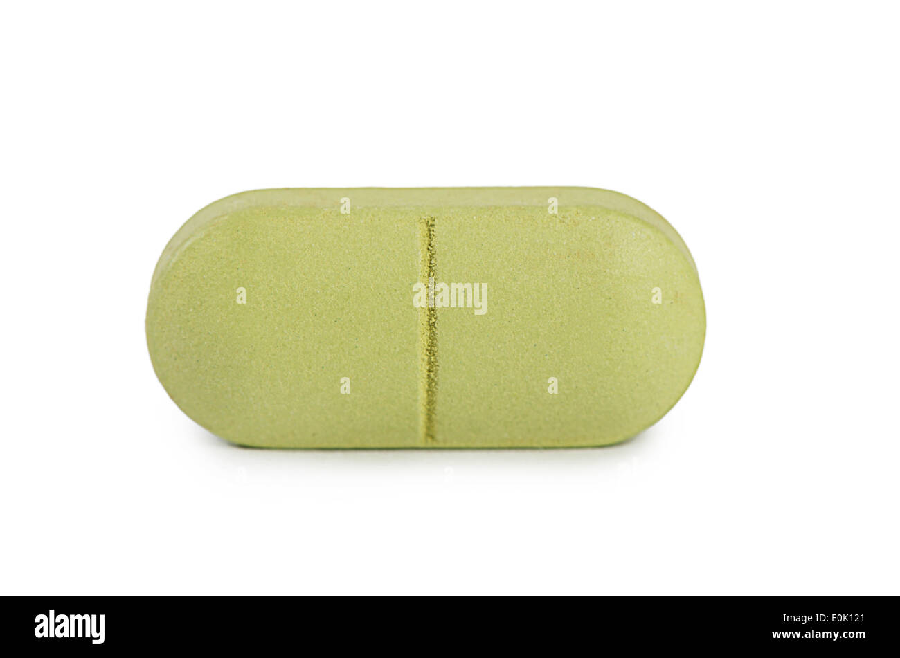 The green pills isolated on white background Stock Photo - Alamy