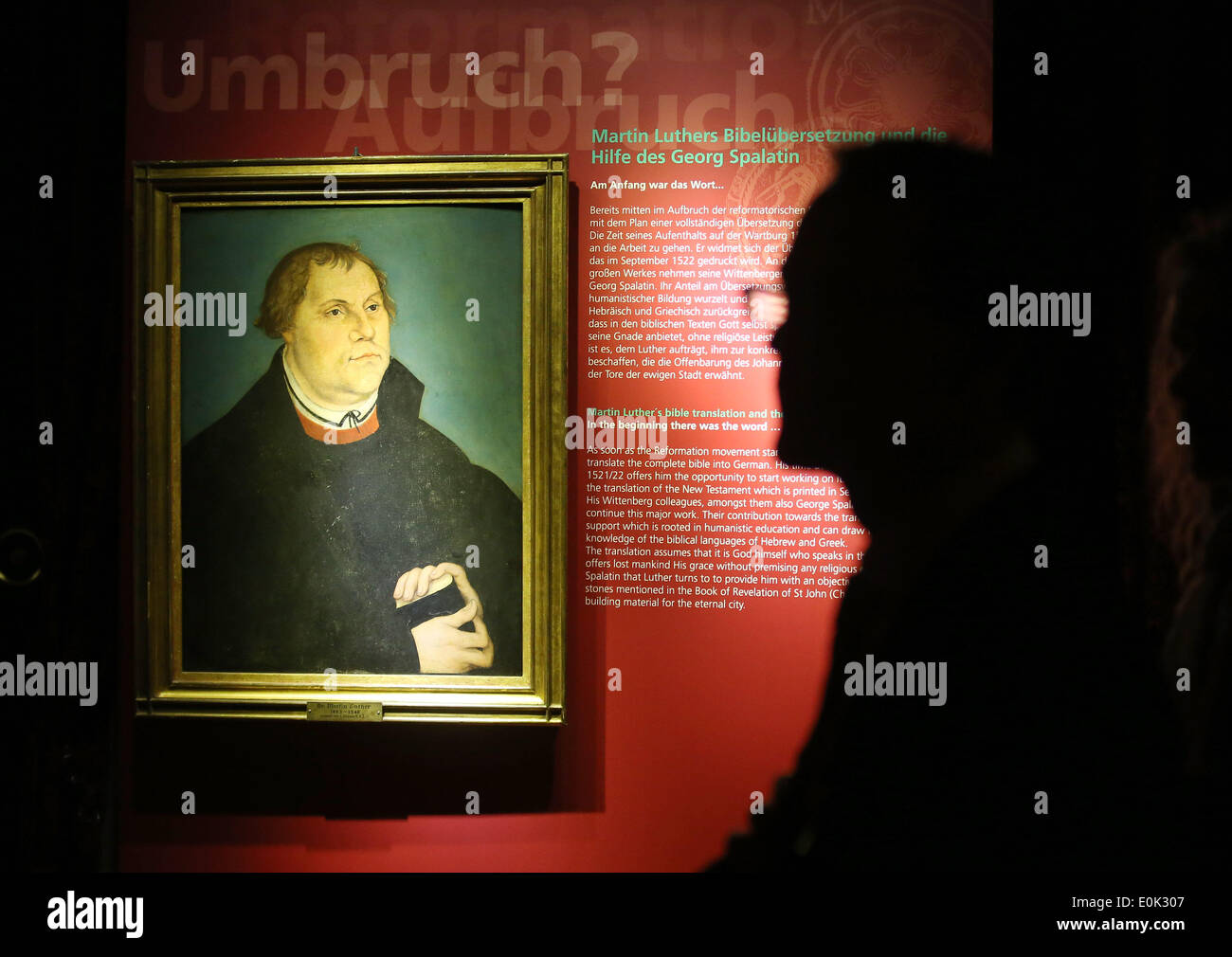 Altenburg, Germany. 15th May, 2014. A man stands next to a portrait of ...