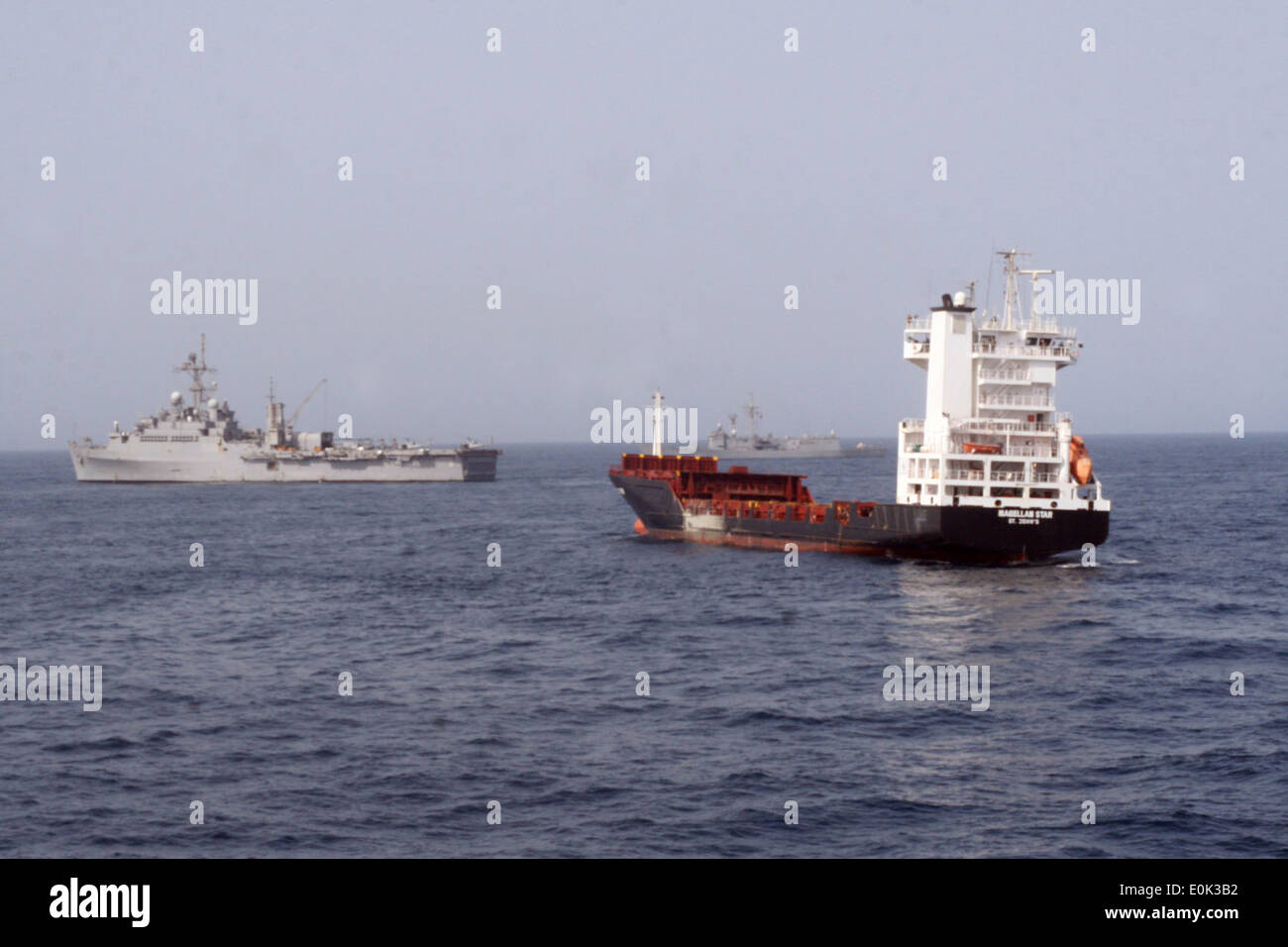 Combined Maritime Task Force 151 flagship, TCG Gökçeada, background, a ...