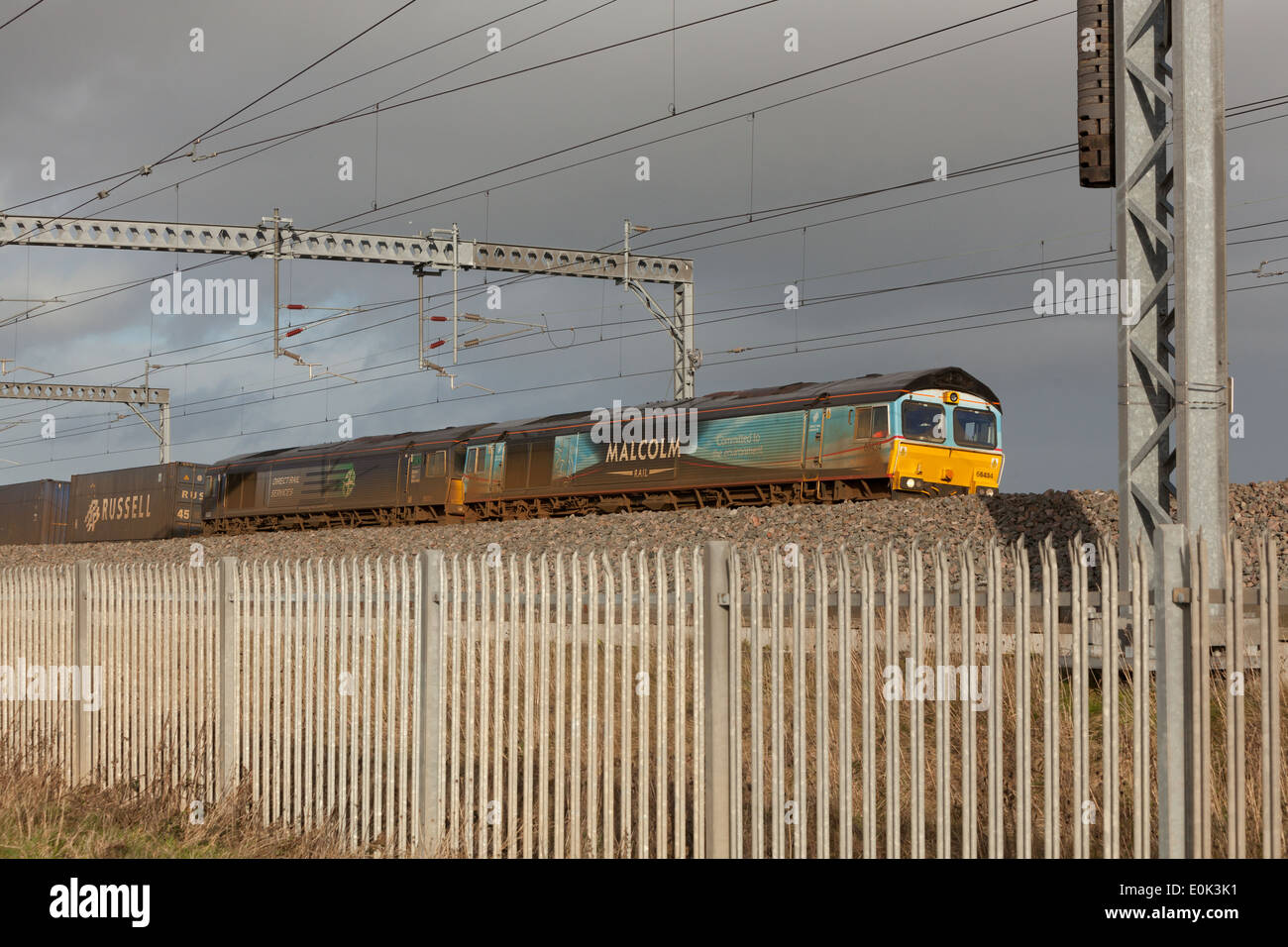 A Class 66 freight train belonging to the Malcolm Rail company working ...