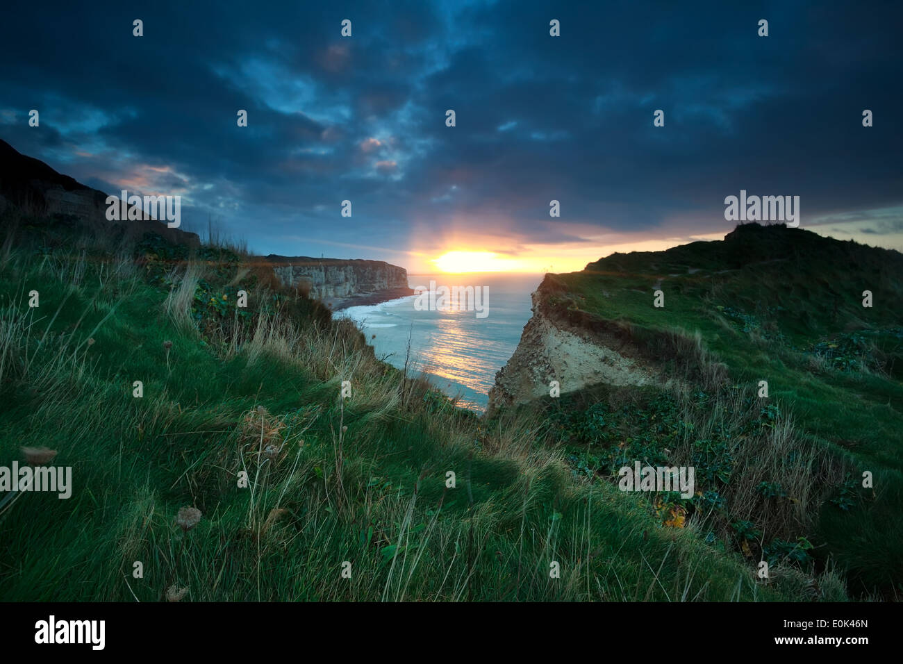 sunset sunshine over cliffs in ocean, Normandy, France Stock Photo - Alamy