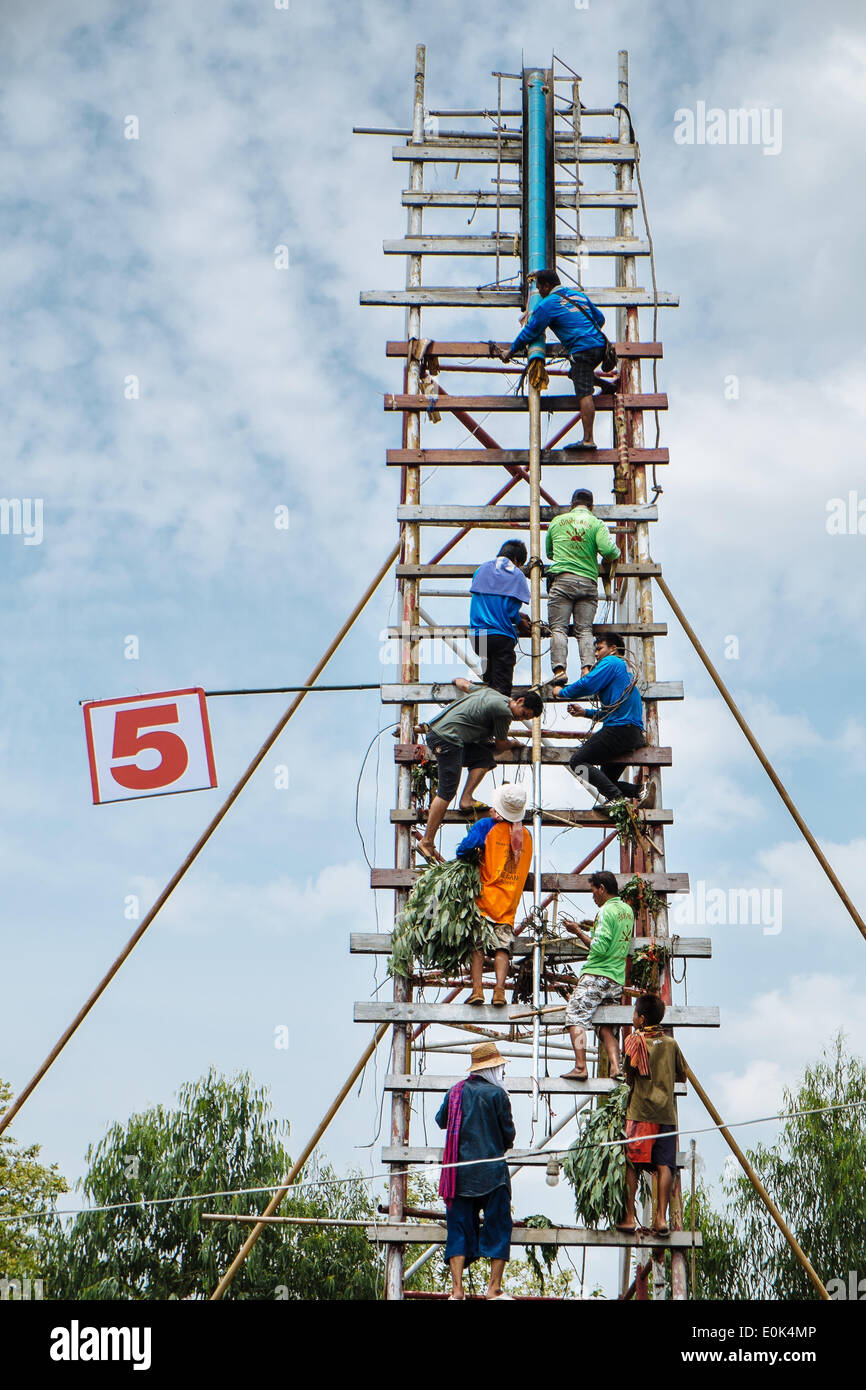 Yasothon, Thailand. 11th May, 2014. A rocket is hoisted onto the launch ...