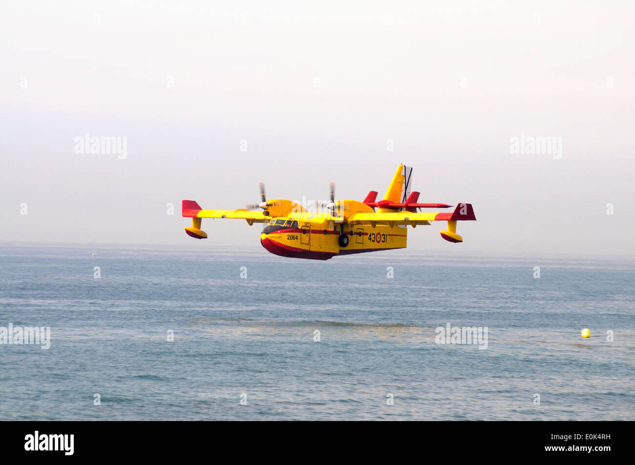 Bombardier/Canadair CL415 fire bomber (number 2064-4331) swooping down ...