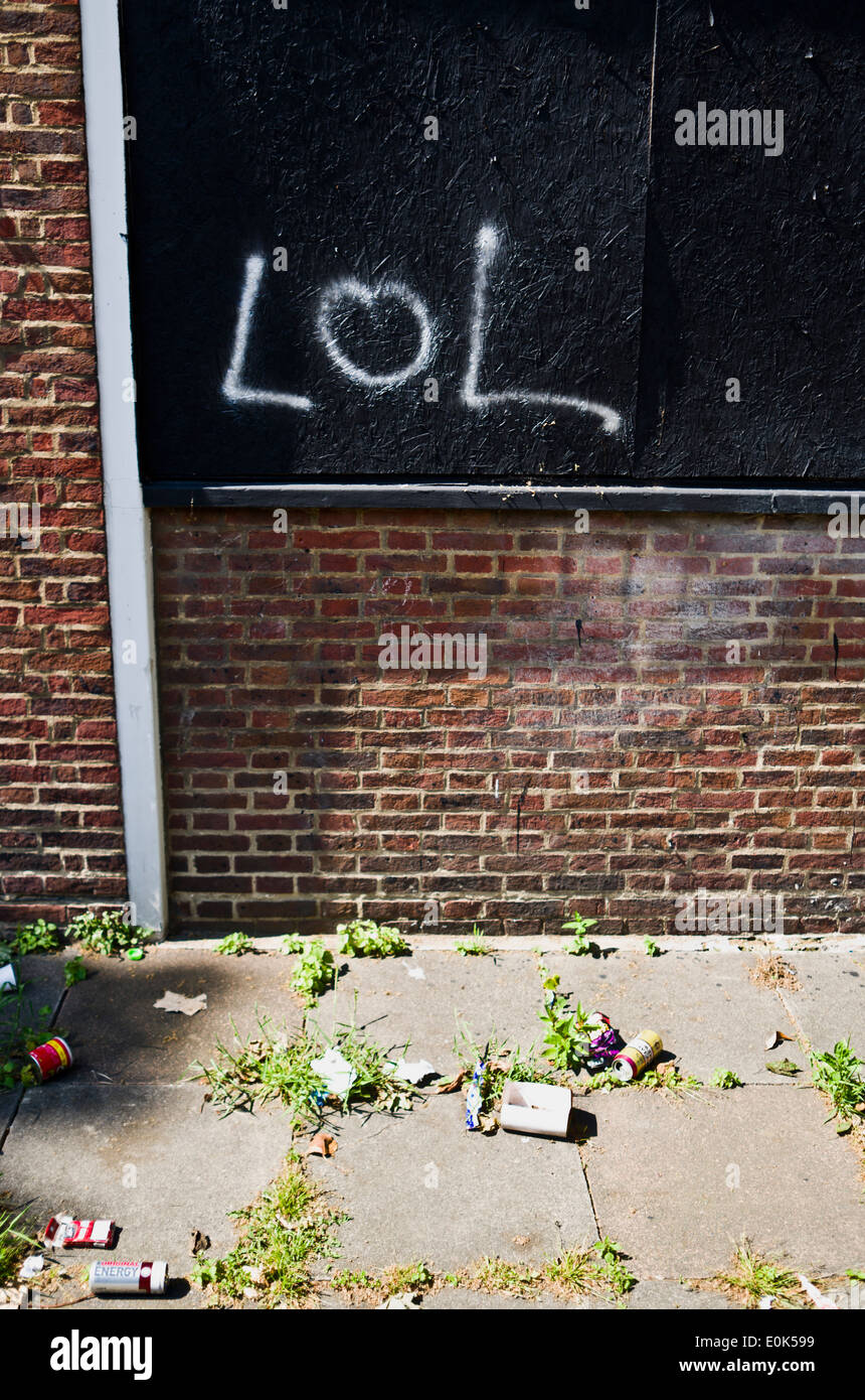 LOL graffiti in rubbish strewn area Stock Photo - Alamy
