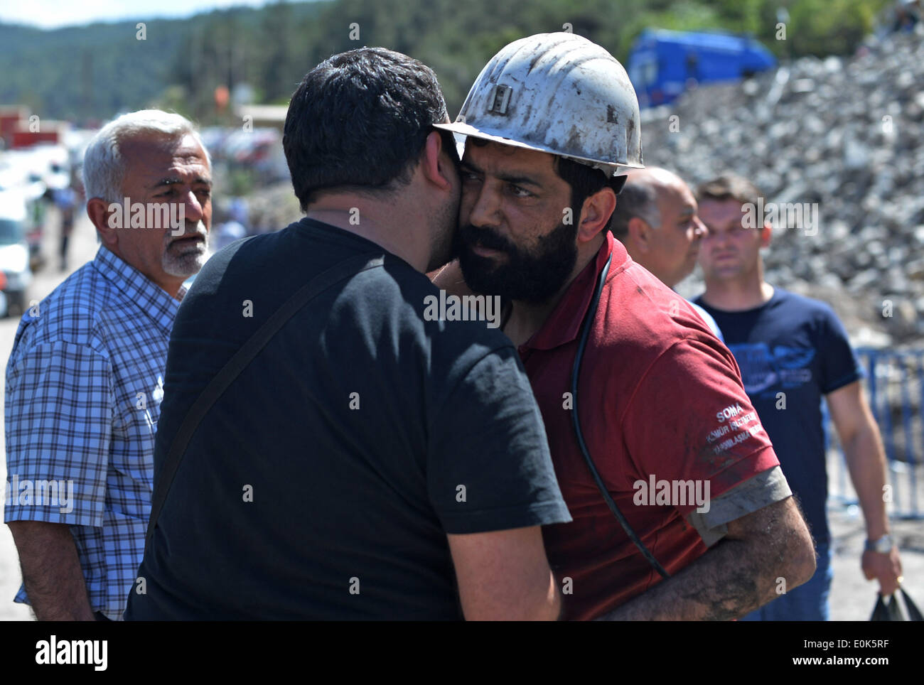 Soma, Turkey. 15th May, 2014. A rescue member hugs a relative of the ...