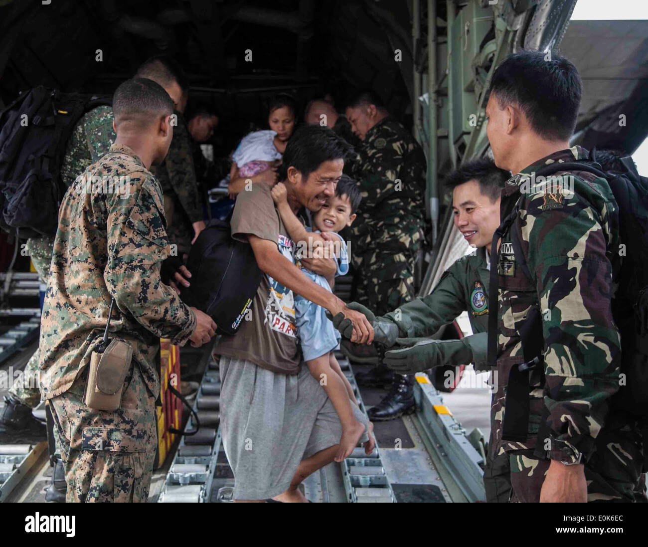 U.S. Marine Lance Cpl. Xavier L. Cannon and members of the Philippine ...
