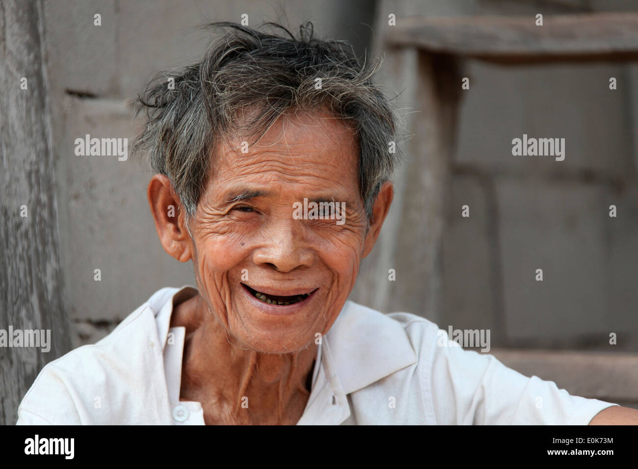Old Asian man smiling Stock Photo - Alamy