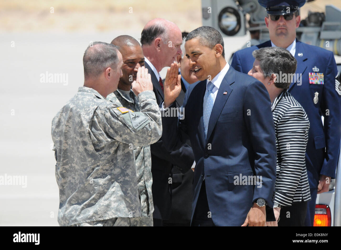 President Barack Obama returns the salute to Command Sgt. Maj. David S ...